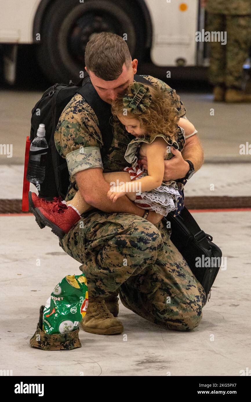 A U.S. Marine greets his family during Marine All Weather Fighter ...