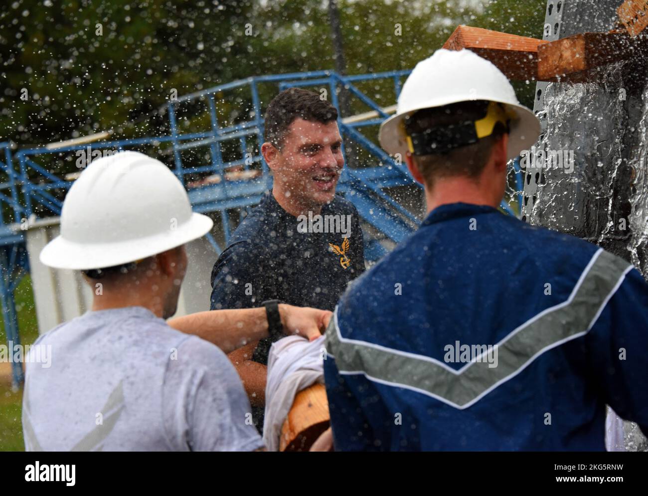 Students work together to repair a mock, damaged object from water ...