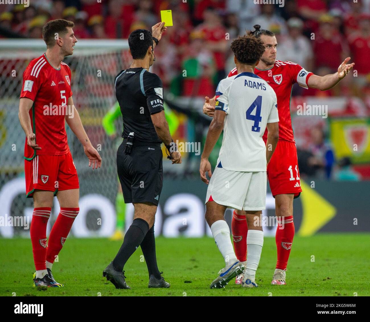 Doha, Qatar. 21st Nov, 2022. Referee shows yellow card for Gareth BALE of Wales during the FIFA ...