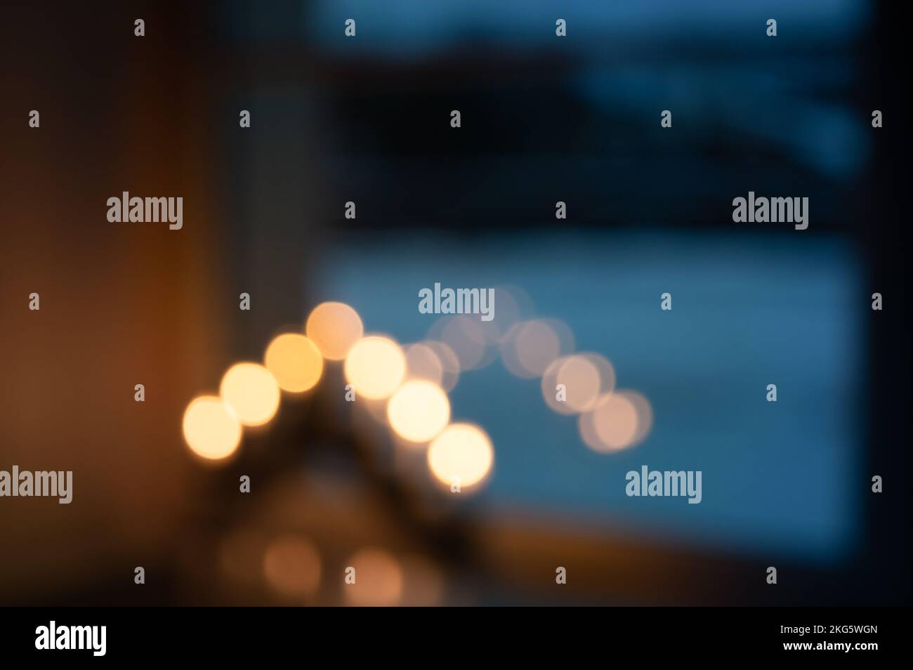 Electric lights bokeh in triangle arrangement. Christmas concept ...