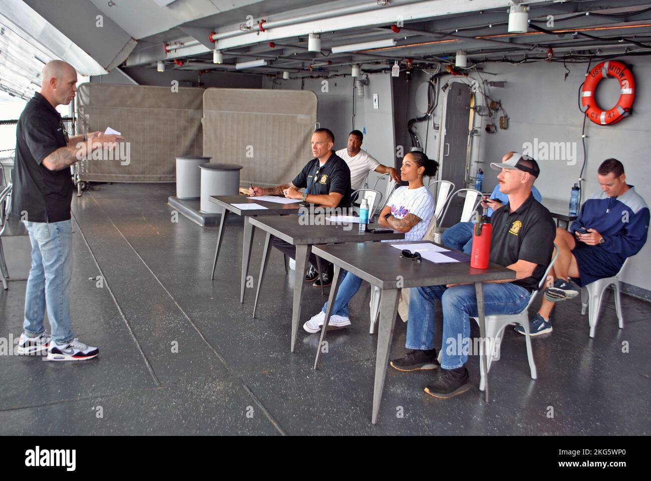 Navy Chief Petty Officer Eugene Nixdorf (San Antonio MEPS) gives a ...