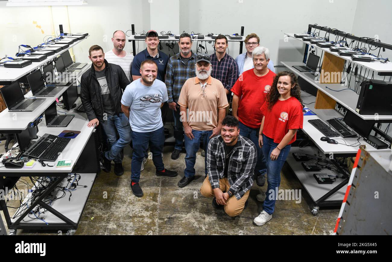 Computer network technicians pose for a photo in the computer staging ...