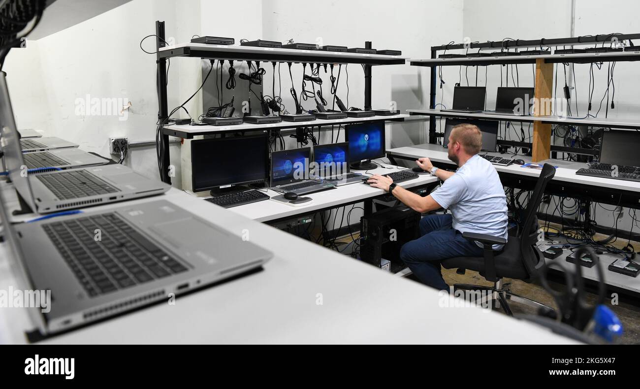 Jonathan Poe, a computer network technician IV, works in the computer ...