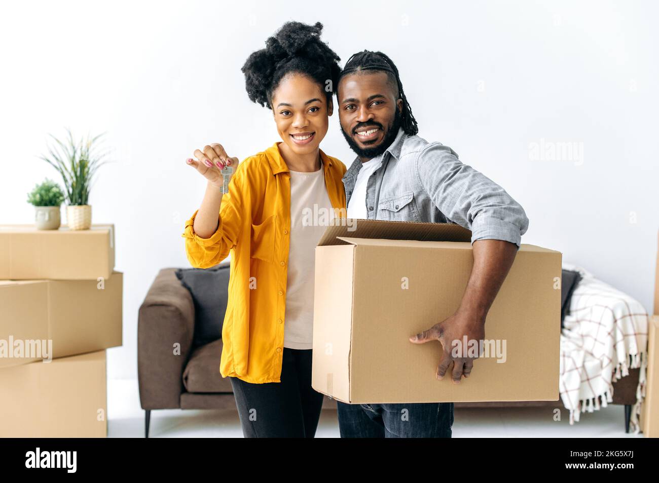 Loving married african american couple moves into their new home. Happy ...