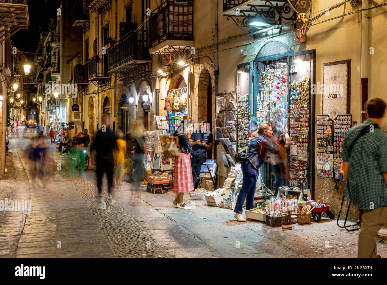 A Colourful Street At Night In The Resort Town of Cefalu, Sicily, Italy ...