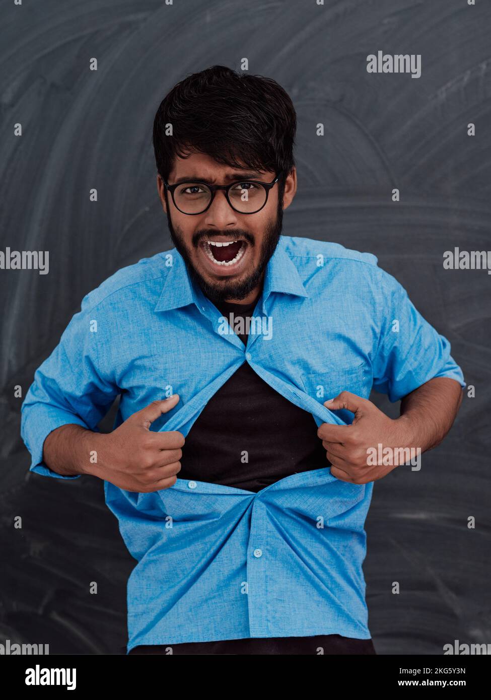 A symbolic photo of an Indian boy showing the superman sign in front of ...