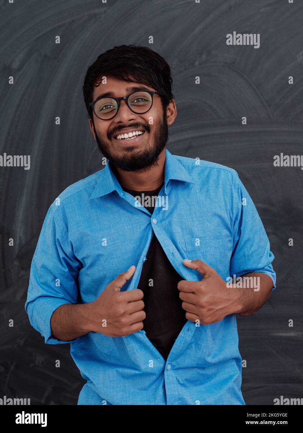 A symbolic photo of an Indian boy showing the superman sign in front of ...