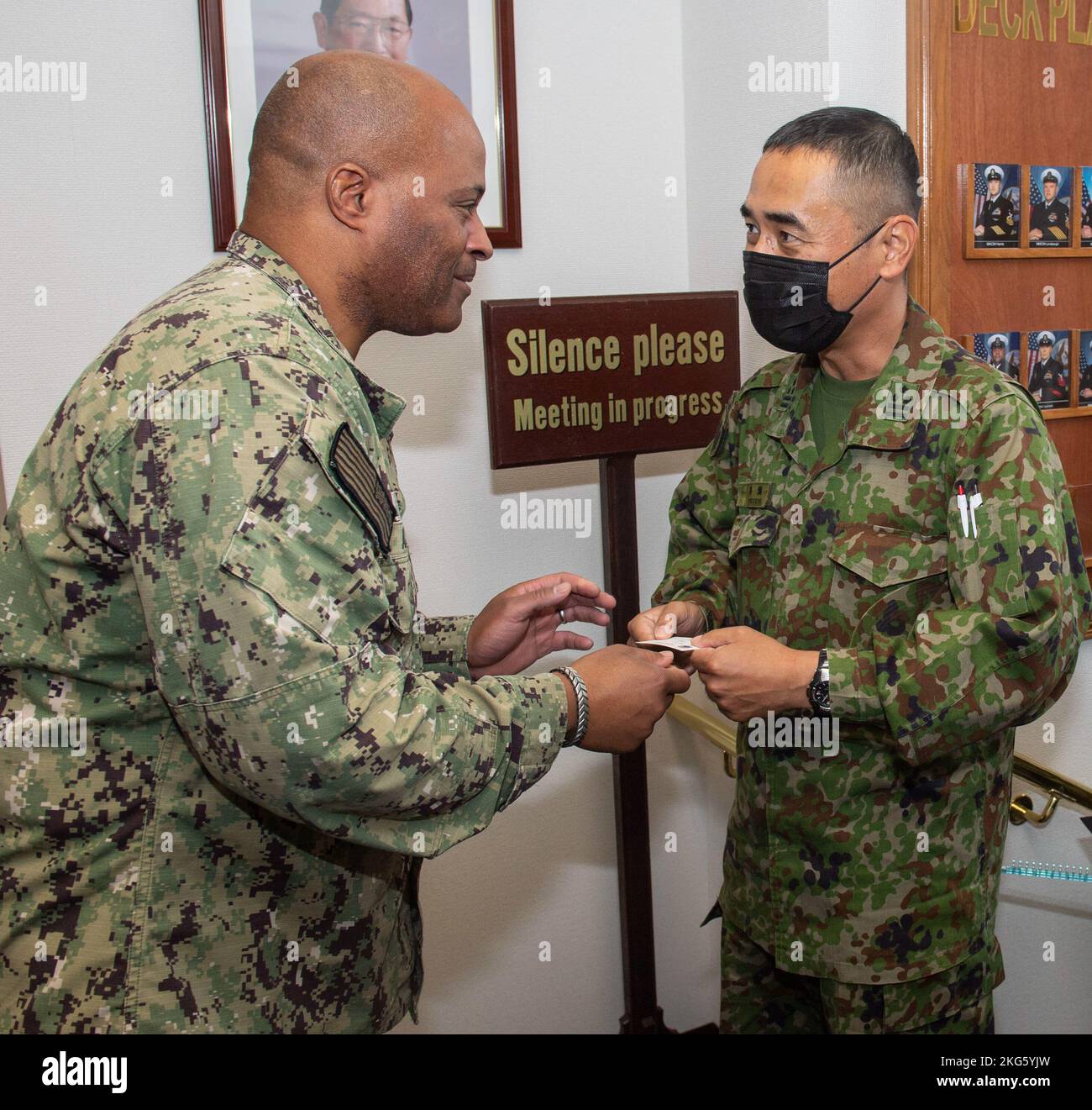 Capt. David Adams, Commander, Fleet Activities Sasebo (CFAS), greets ...