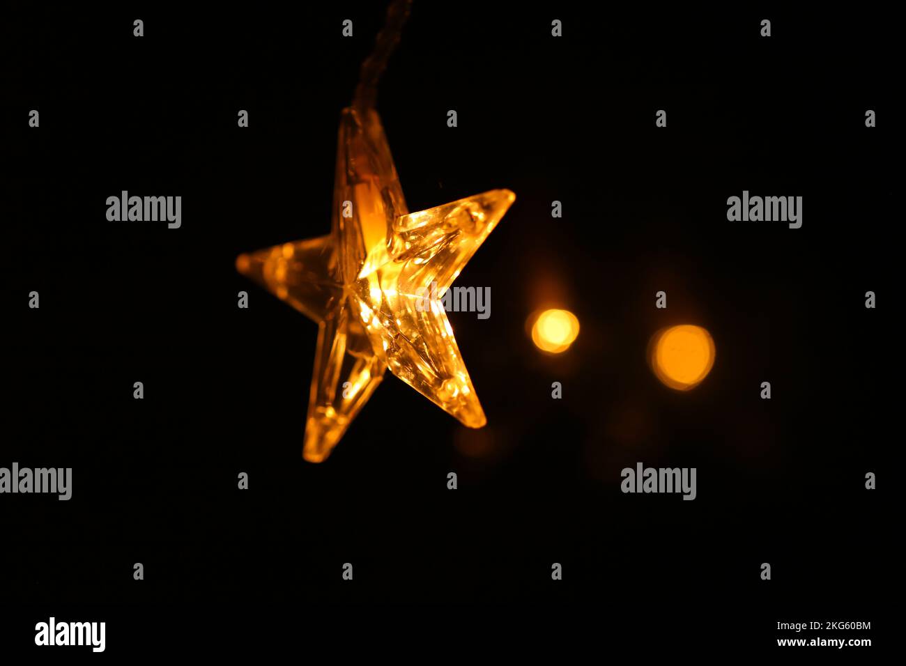 Christmas wallpaper.Star burning on a dark background.Christmas and New ...