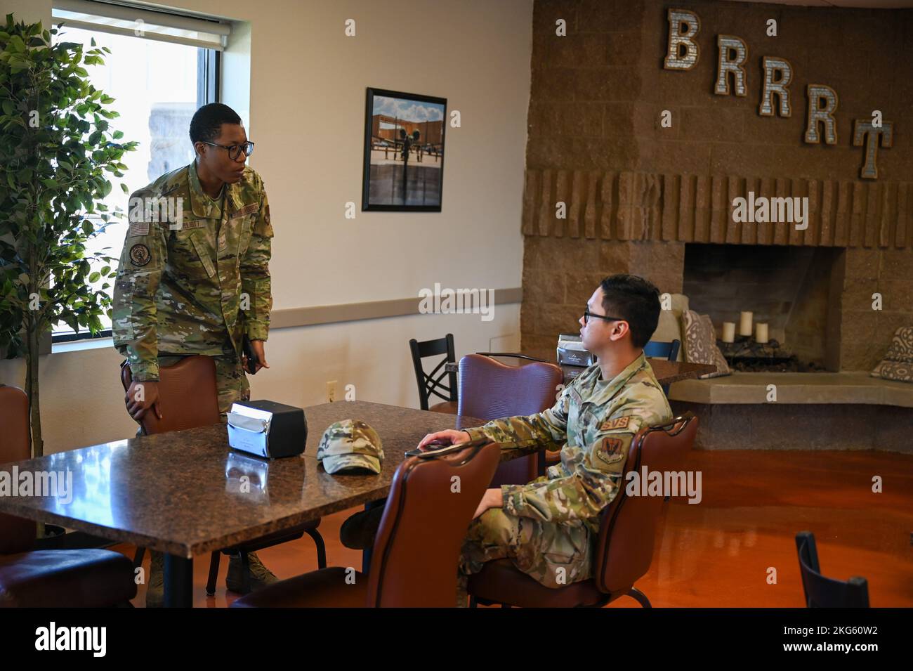 U.S. Air Force Airmen sit down and prepare to eat a meal at Fast ...