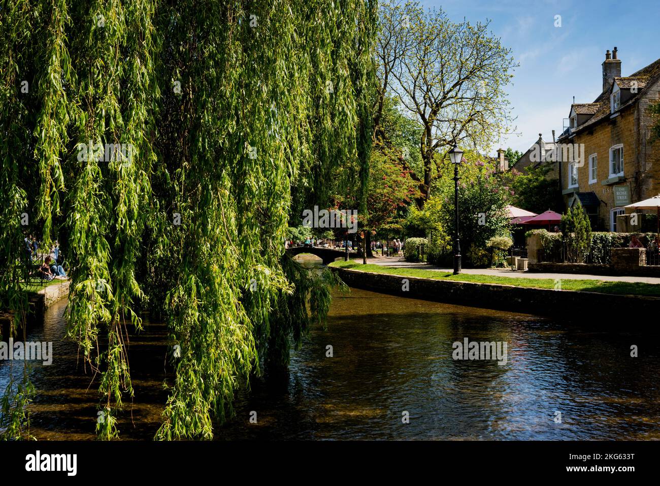 River Windrush and low arched stone pedestrian bridges in Bourton-on ...