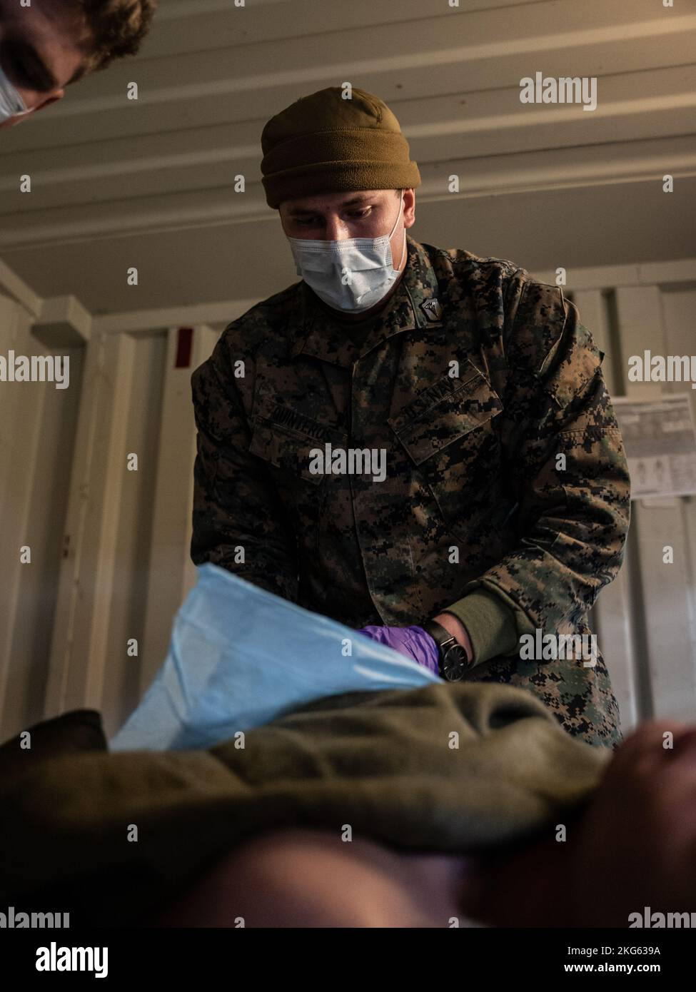 U.S. Navy Petty Officer Third Class Justino Quinteros, a corpsman with ...