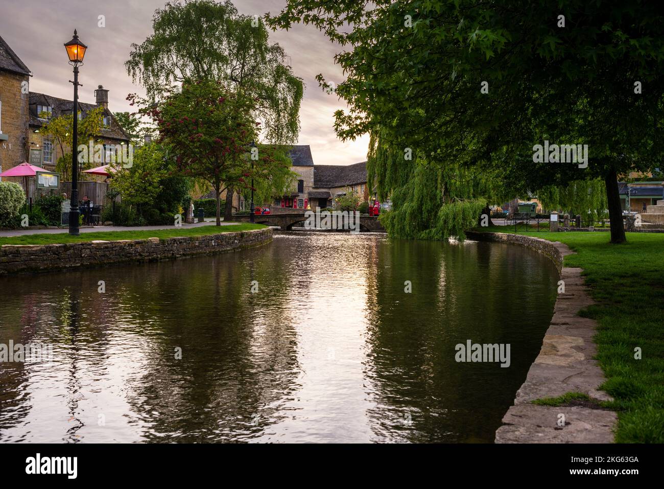River Windrush and low arched stone pedestrian bridges in Bourton-on ...