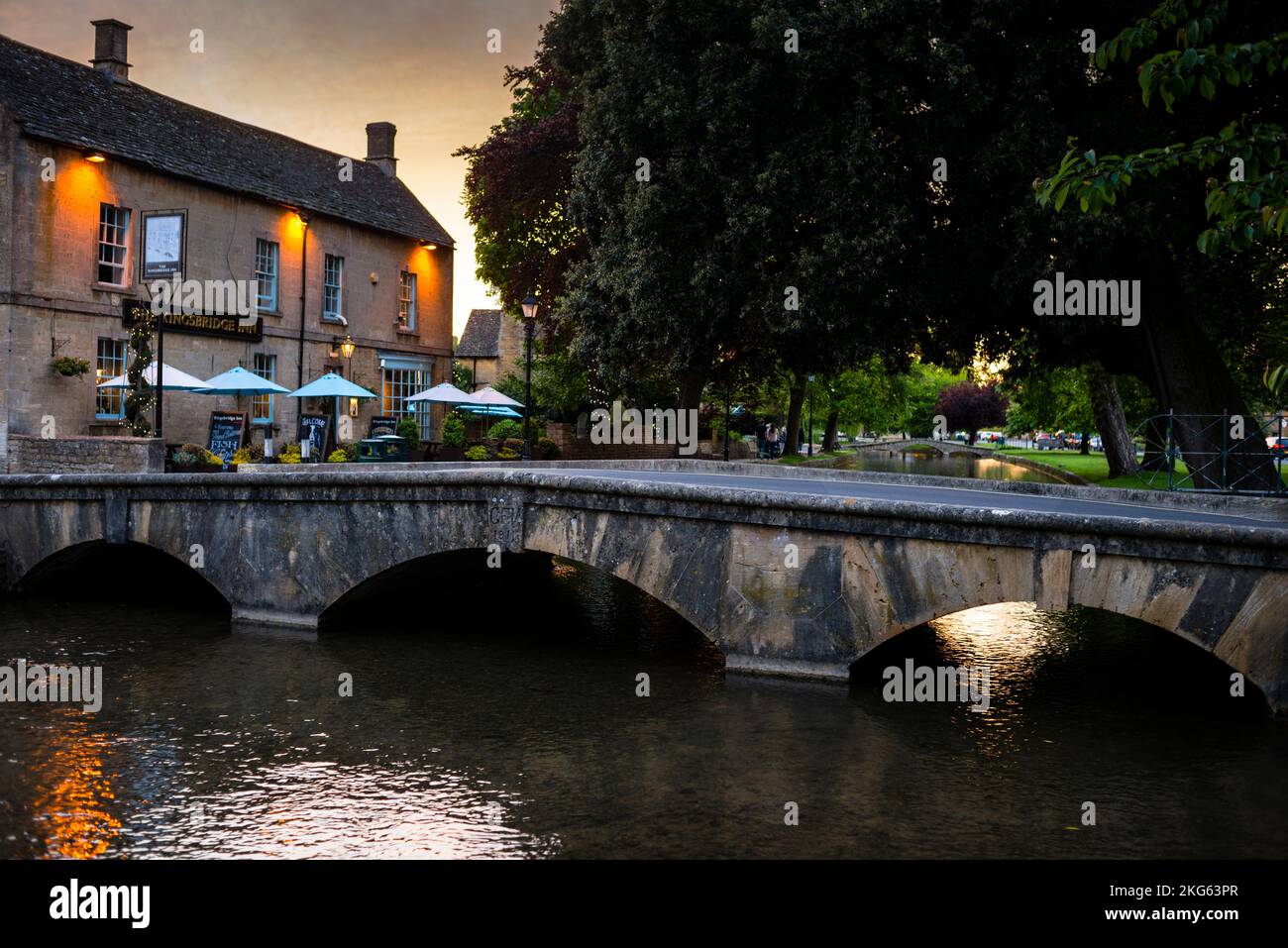 Bourton-on-the-Water by the River Windrush and one of five old arched ...