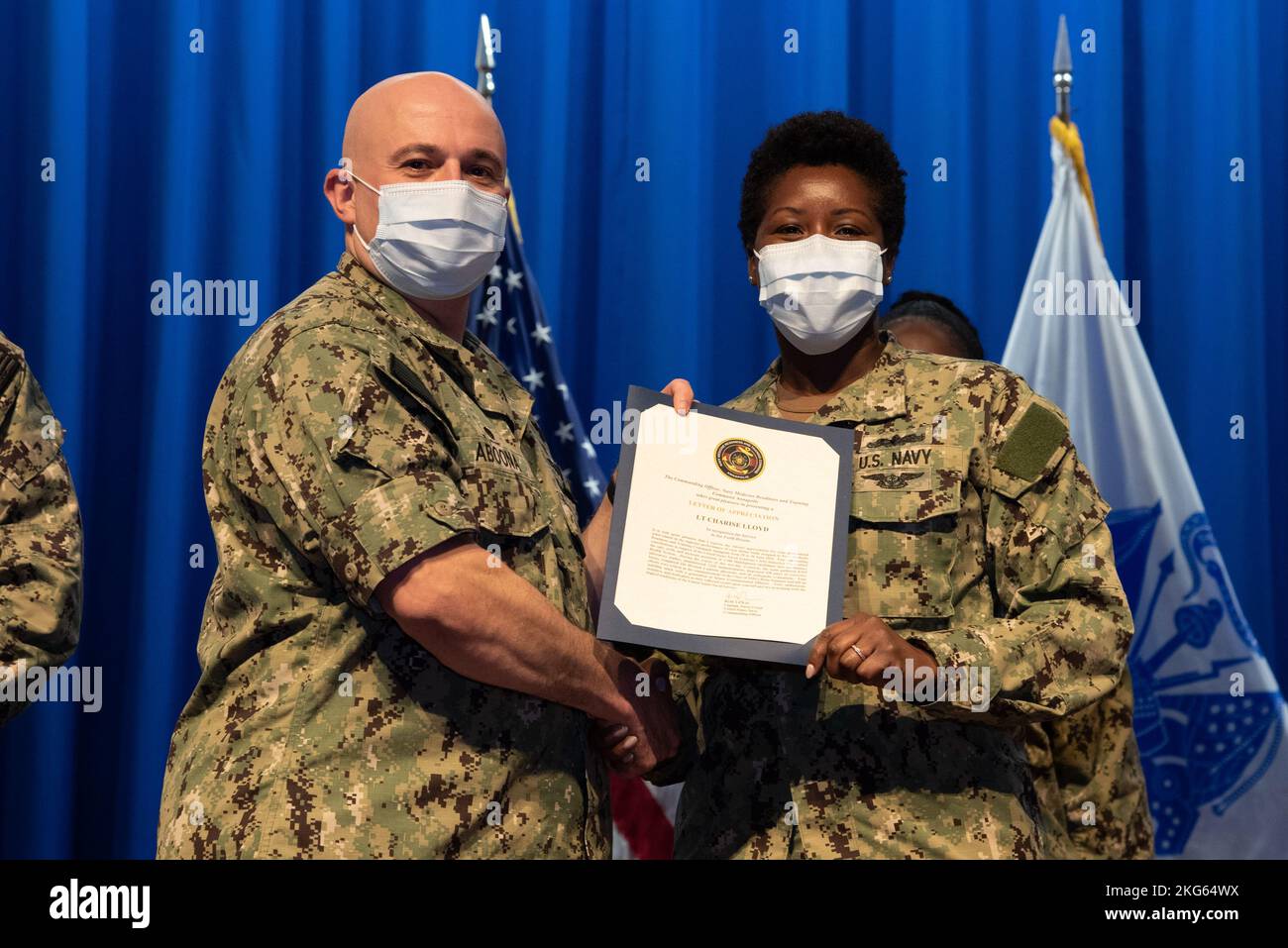 Lt. Charise Lloyd receives a Letter of Appreciation from Capt. Steve ...