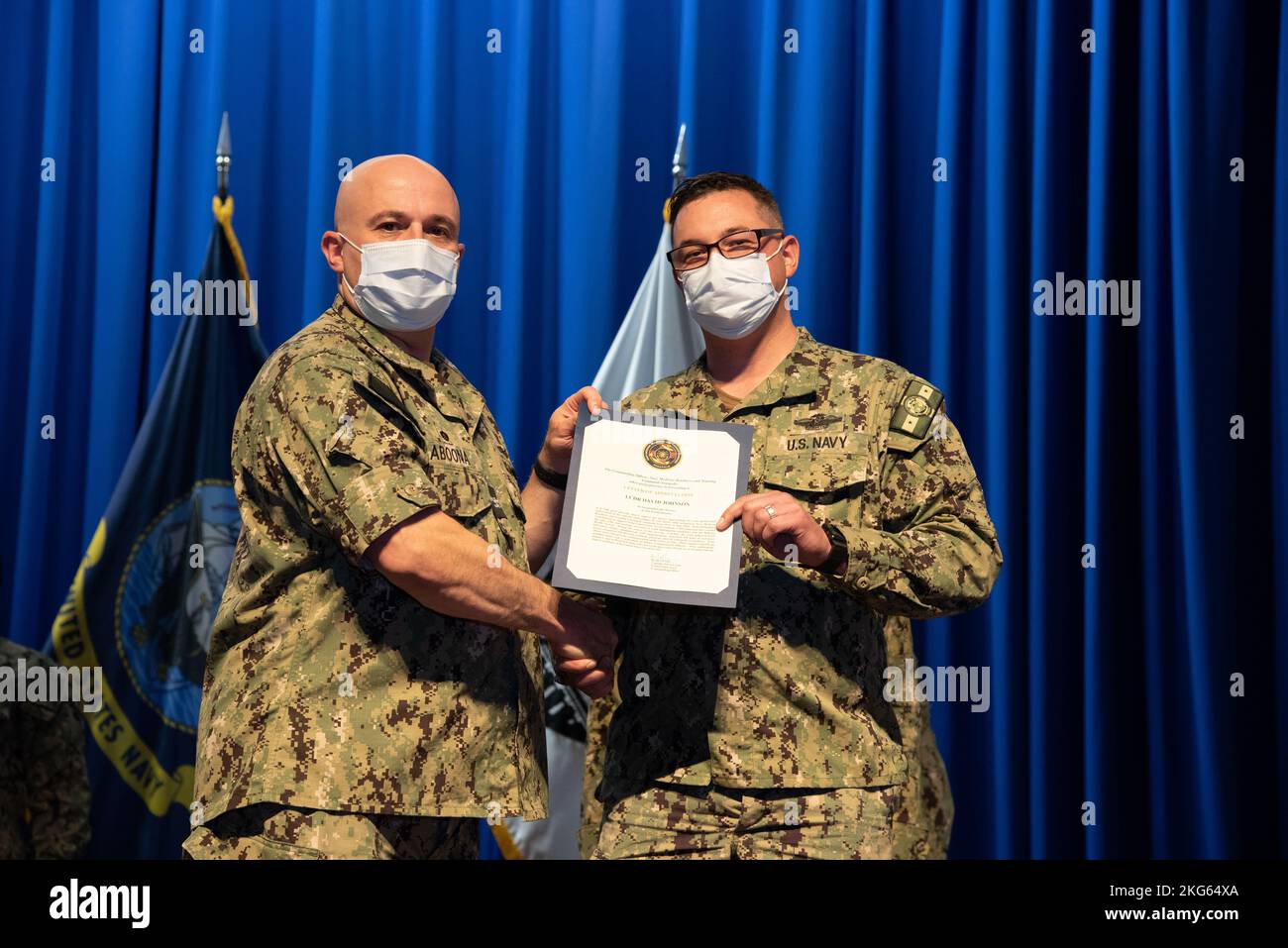 Lt. Cmdr. David Johnson receives a Letter of Appreciation from Capt ...