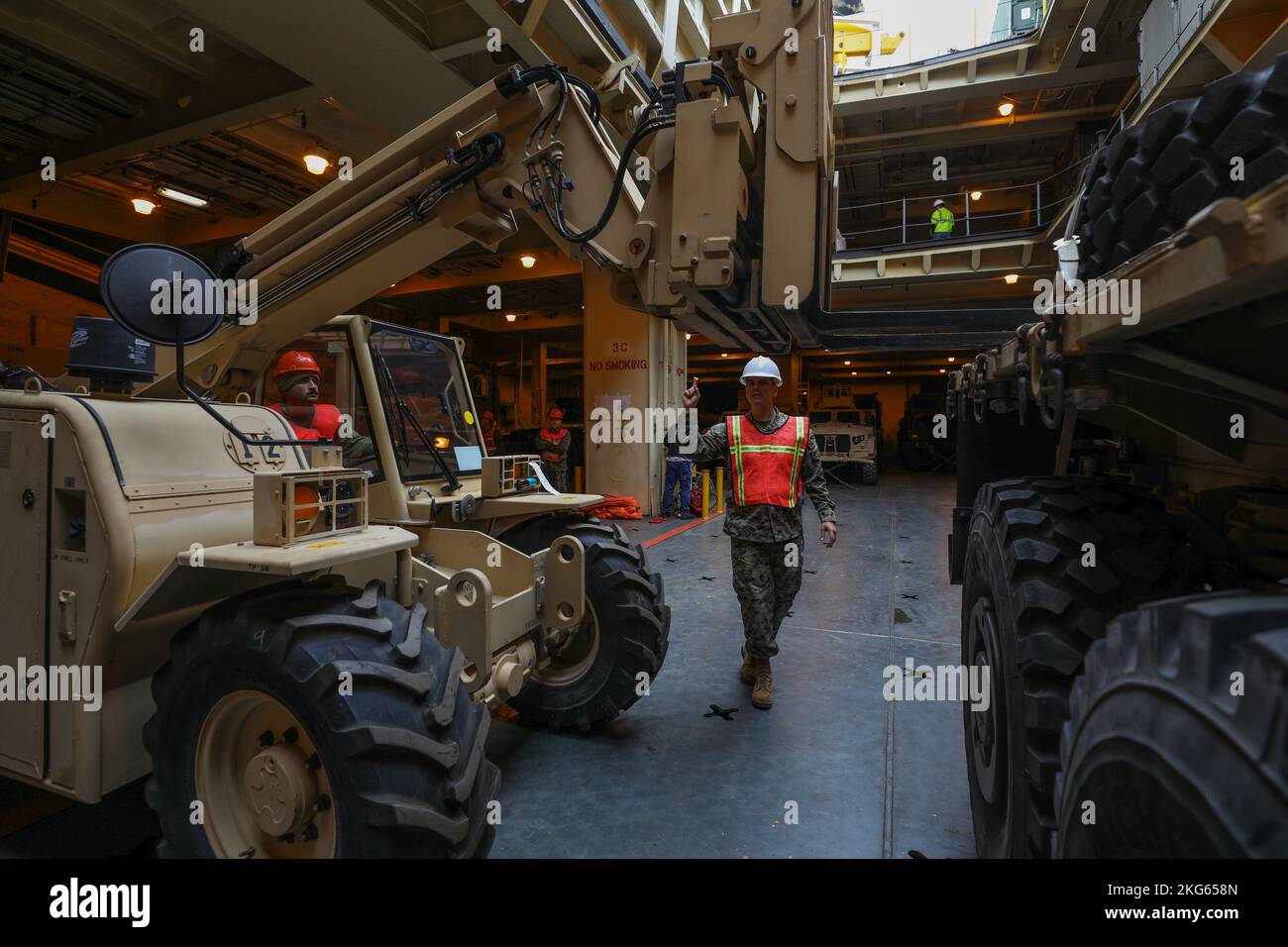 U.S. Marine Corps Staff Sgt. Kurtis Dismore, right, an embarkation ...
