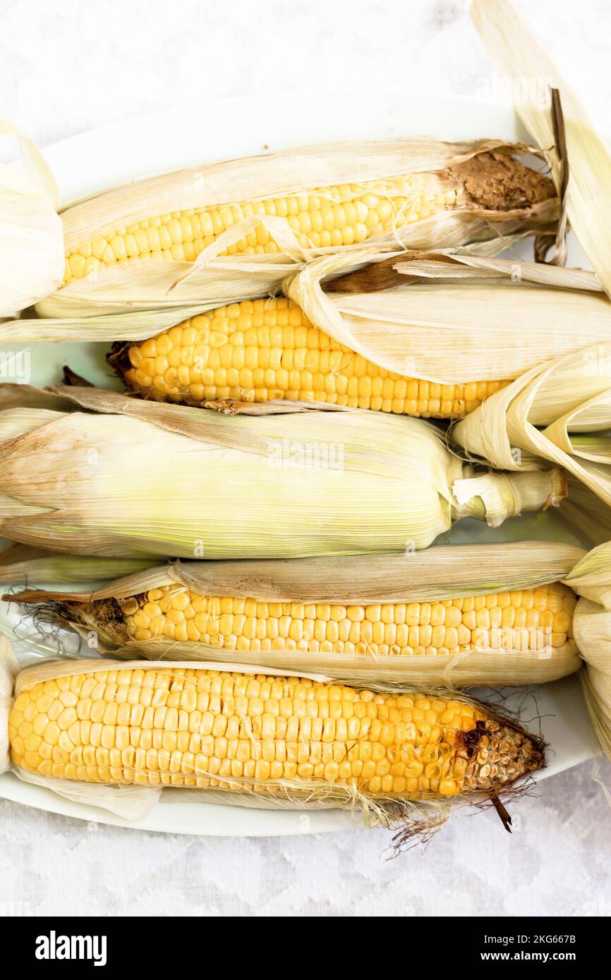 A vertical shot of corn on the cob isolated on white background Stock ...