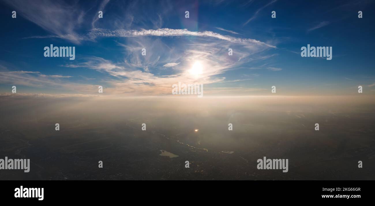 Aerial view from airplane window at high altitude of earth covered with ...