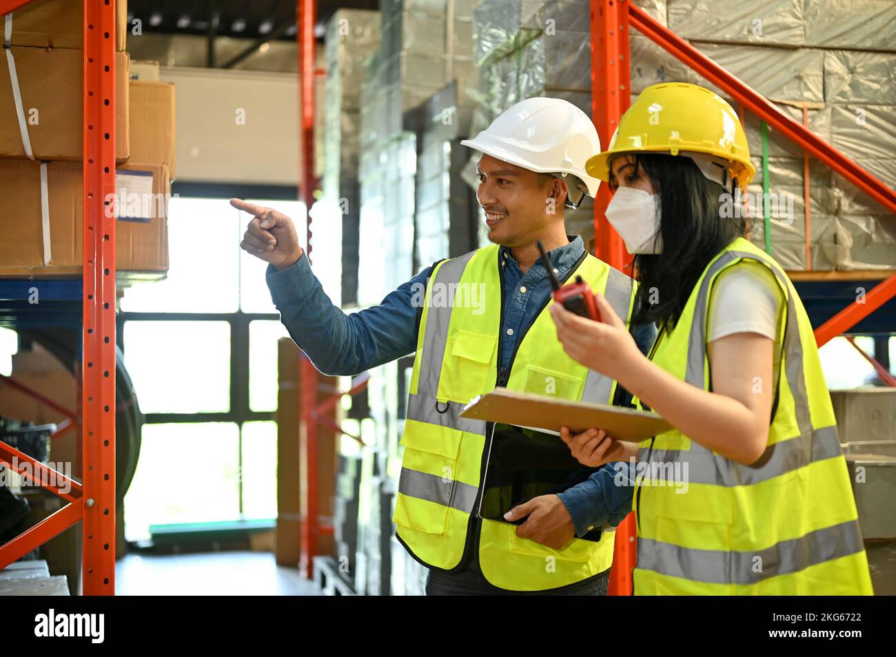 Smart and professional millennial Asian male warehouse supervisor ...