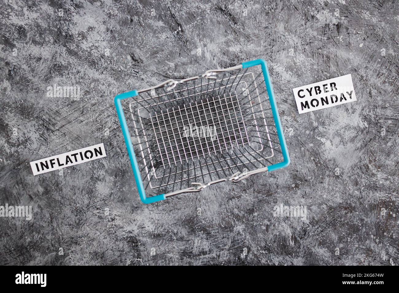Inflation vs Cyber Monday conceptual image with empty shopping basket ...