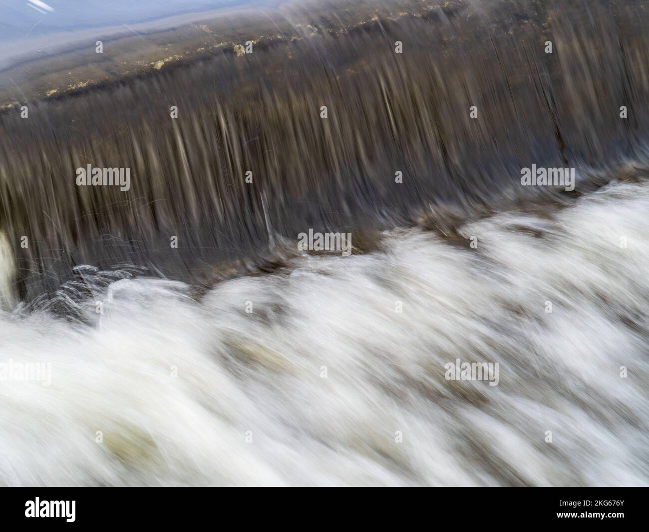 A small flat cascade in a calm river. Water background Stock Photo - Alamy