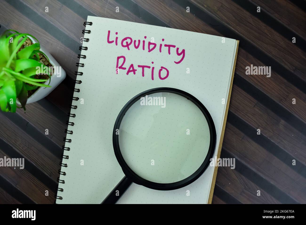 Concept of Liquidity Ratio write on a book isolated on Wooden Table ...