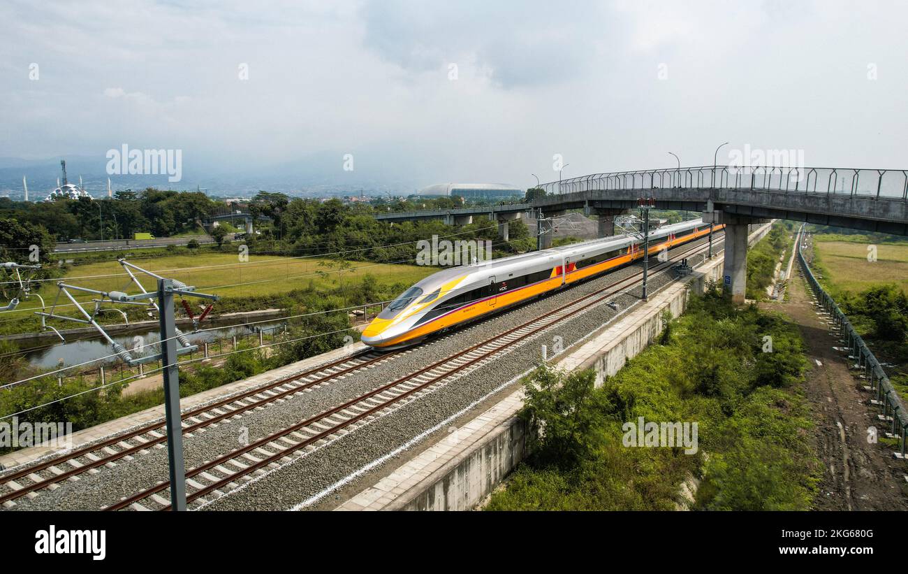 Aerial view of the High speed orange train on the railway station. High ... Aerial view of the High speed orange train on the railway station. High ...