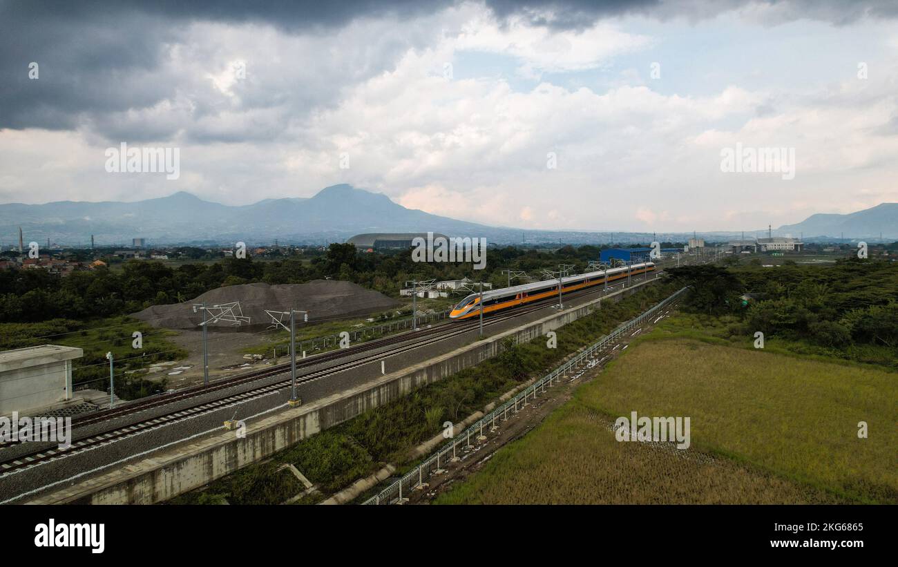 Aerial view of the High speed orange train on the railway station. High ... Aerial view of the High speed orange train on the railway station. High ...