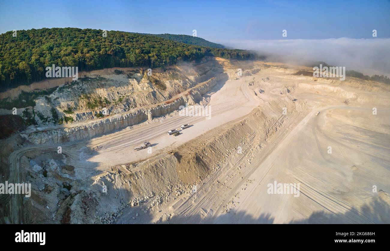 Aerial view of open pit mining site of limestone materials extraction ...