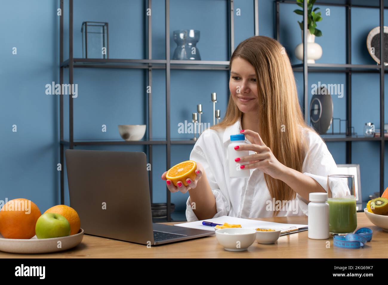 The doctor shows the client organic products and a jar of vitamins ...