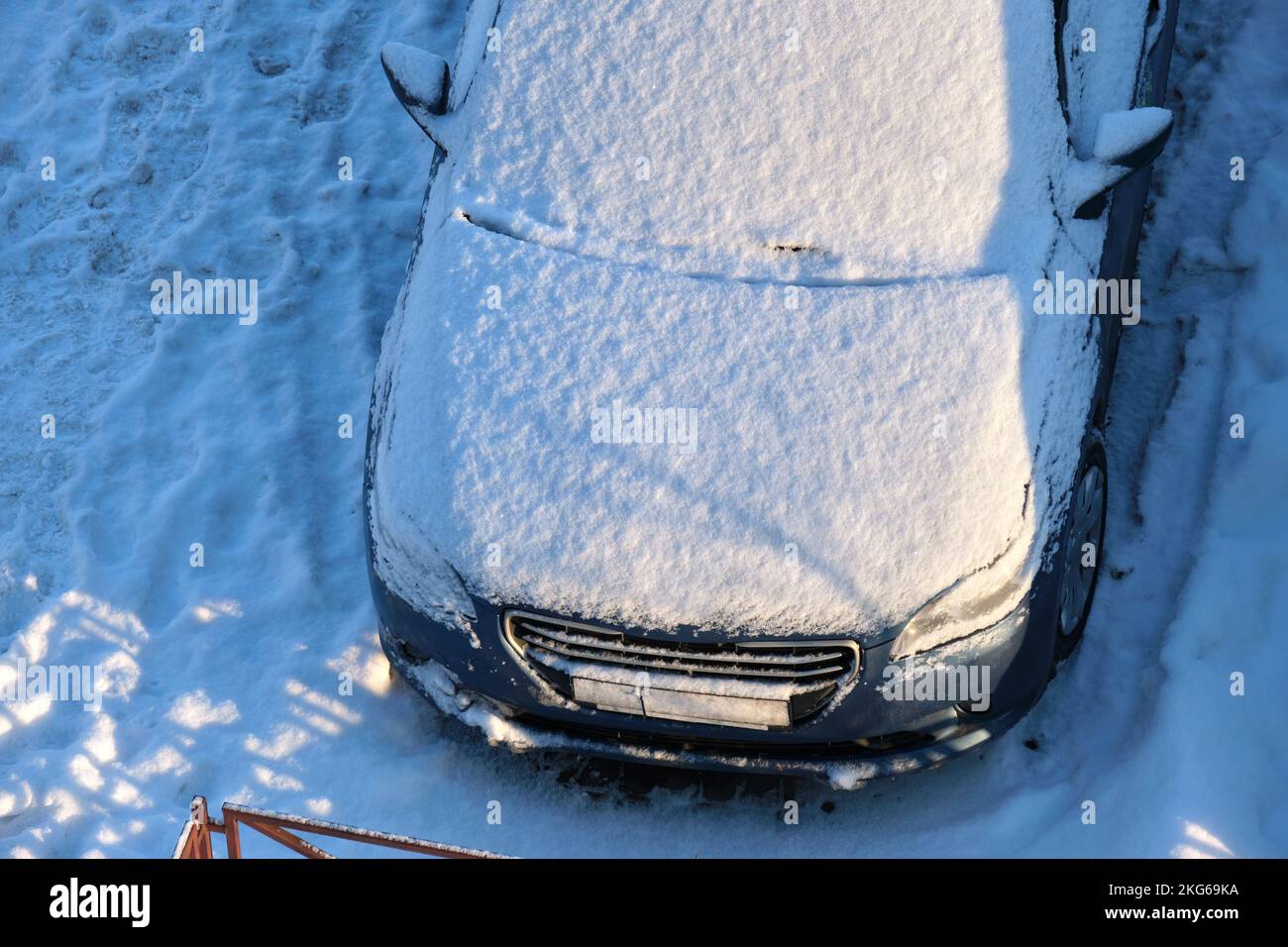 Car parked on snow covered slippery road on cold winter day Stock Photo ...