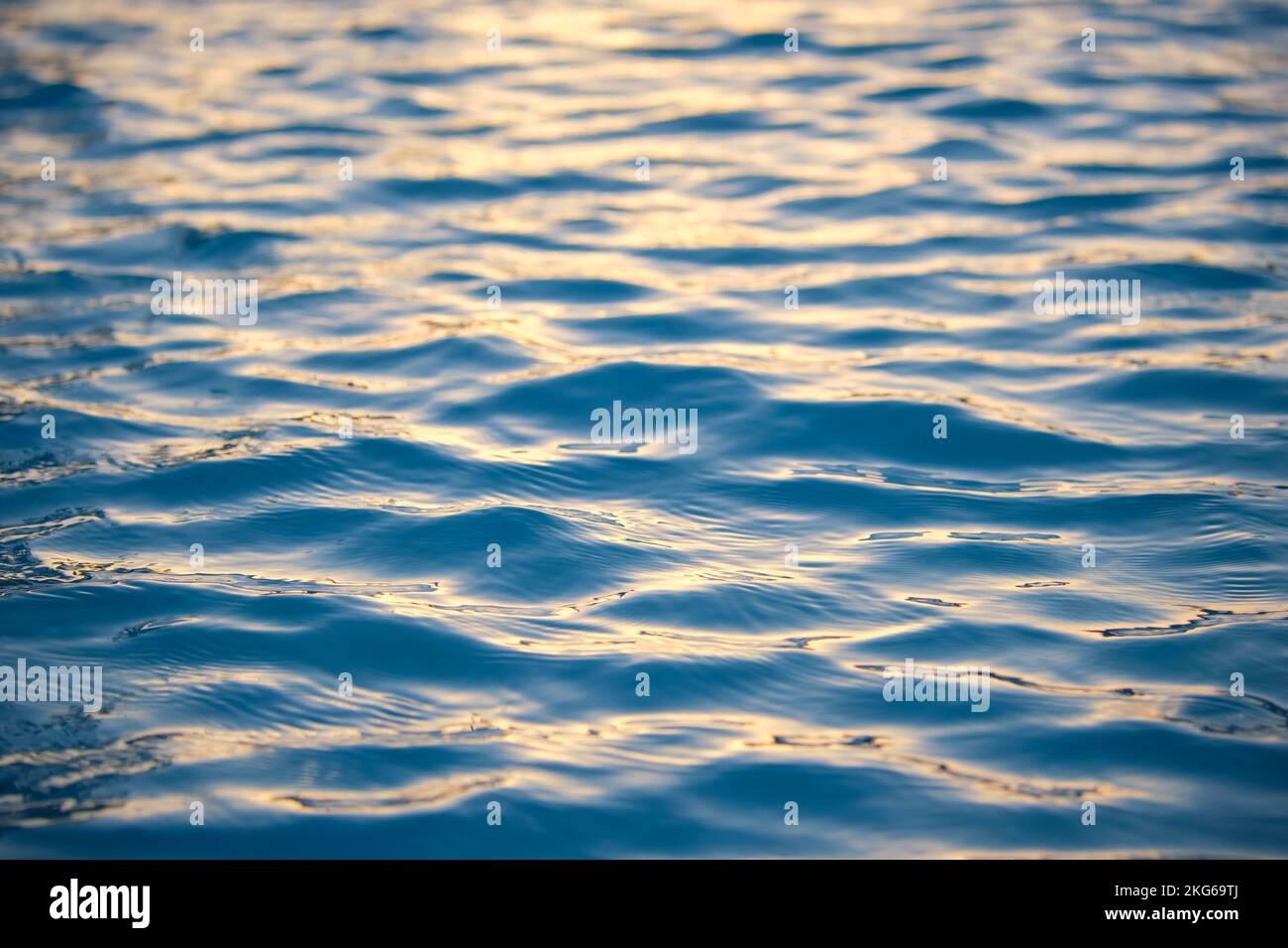 Closeup seascape surface of blue sea water with small ripple waves ...