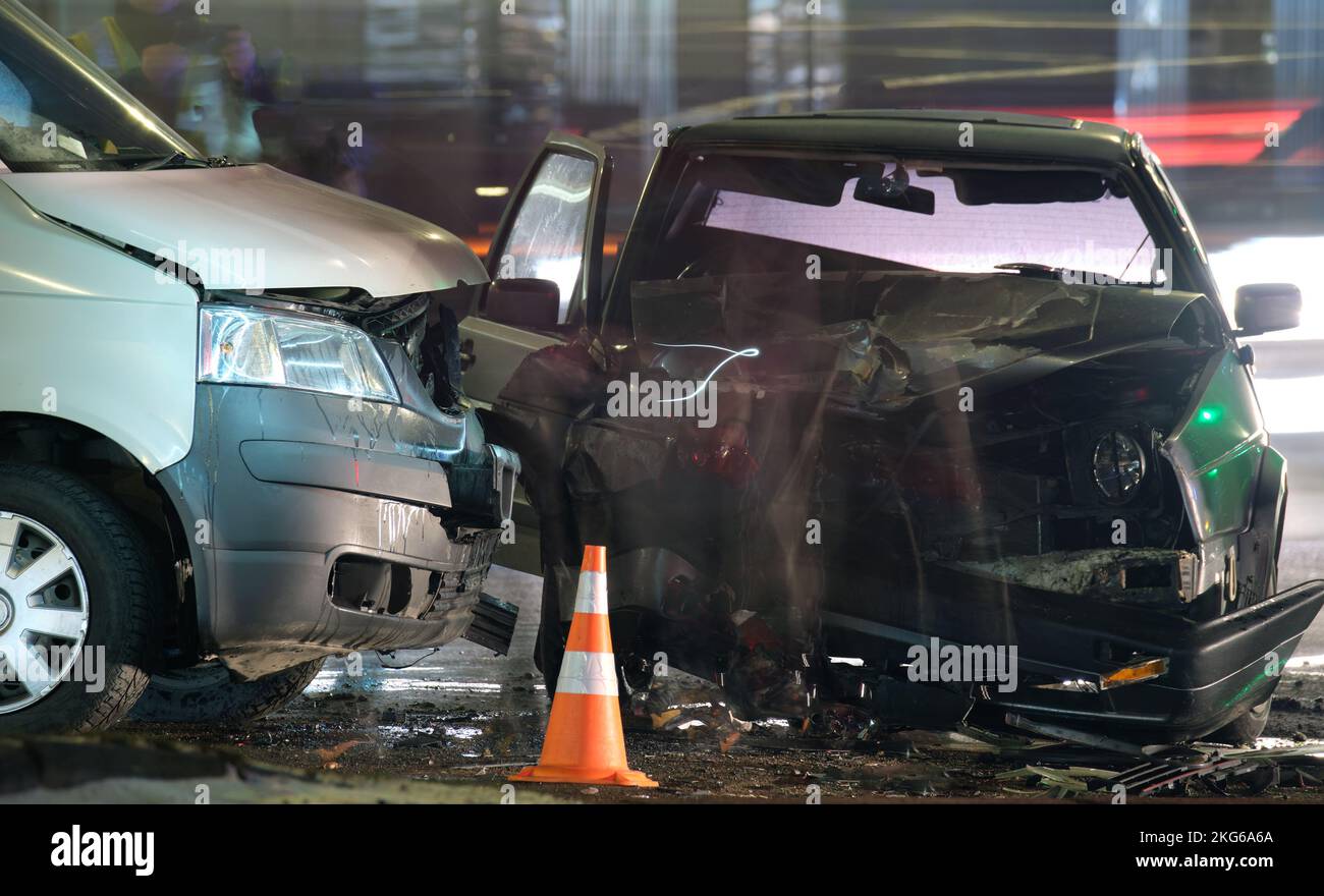 Damaged in heavy car accident vehicles after collision on city street ...