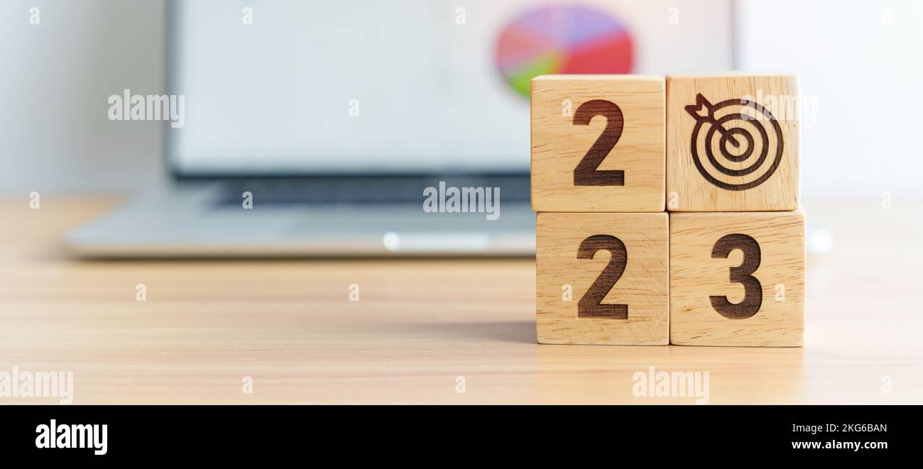 2023 Year block with dartboard icon against computer laptop background. Goal, Target, Resolution ...