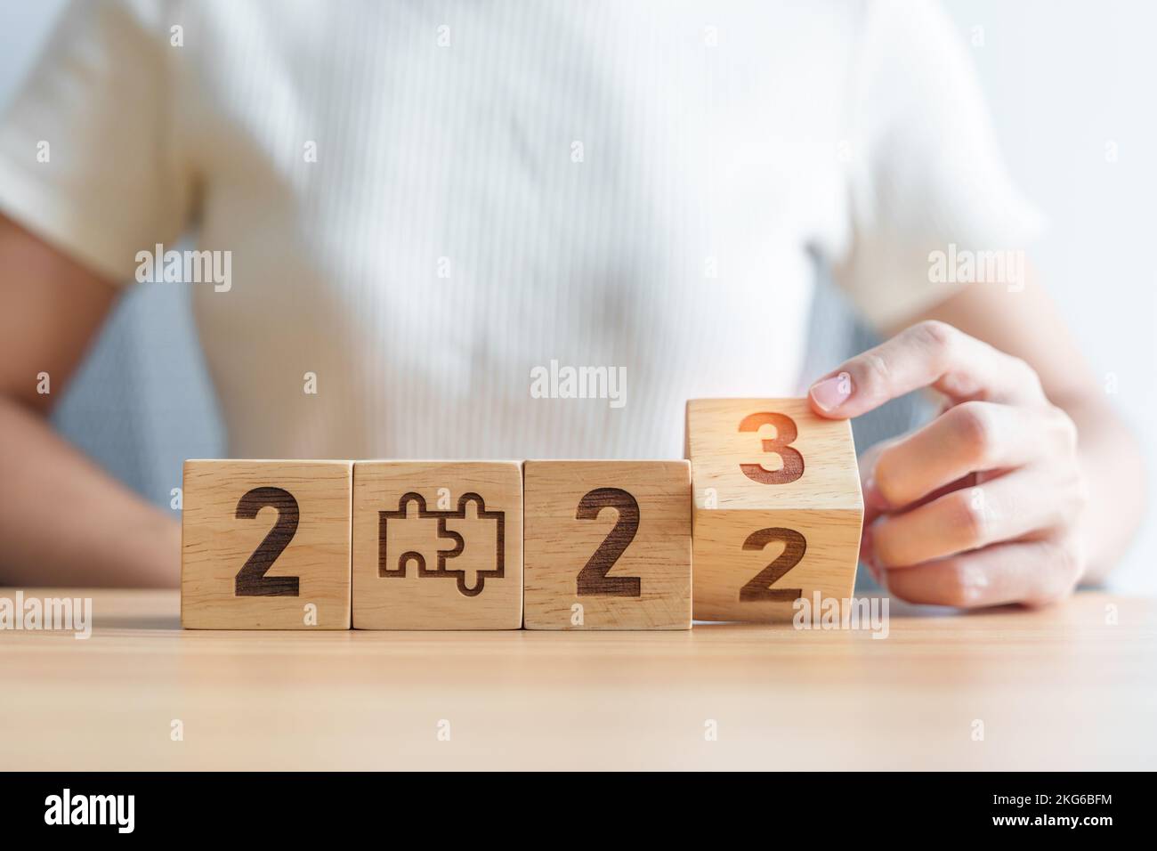 woman hand change 2022 to 2023 block with jigsaw puzzle icon. Business ...