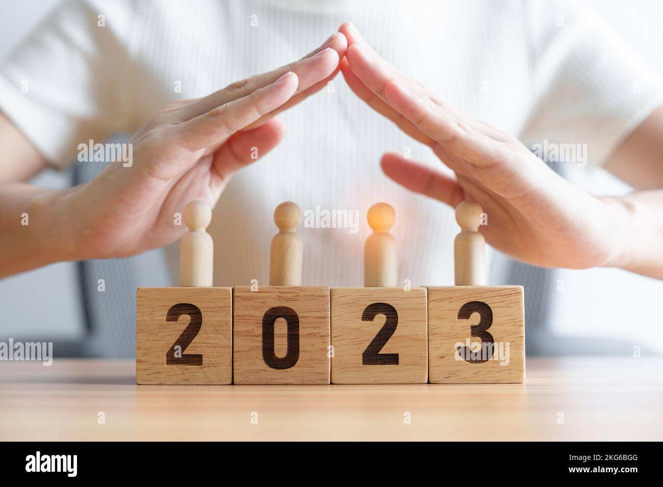 hand cover wooden man employees with 2023 Year block. Insurance ...