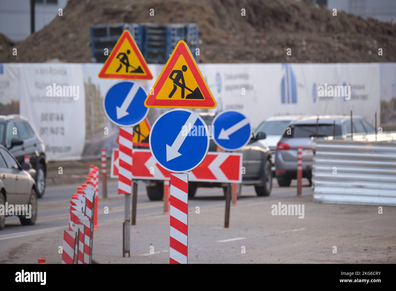 Roadworks warning traffic signs of construction work on city street and ...