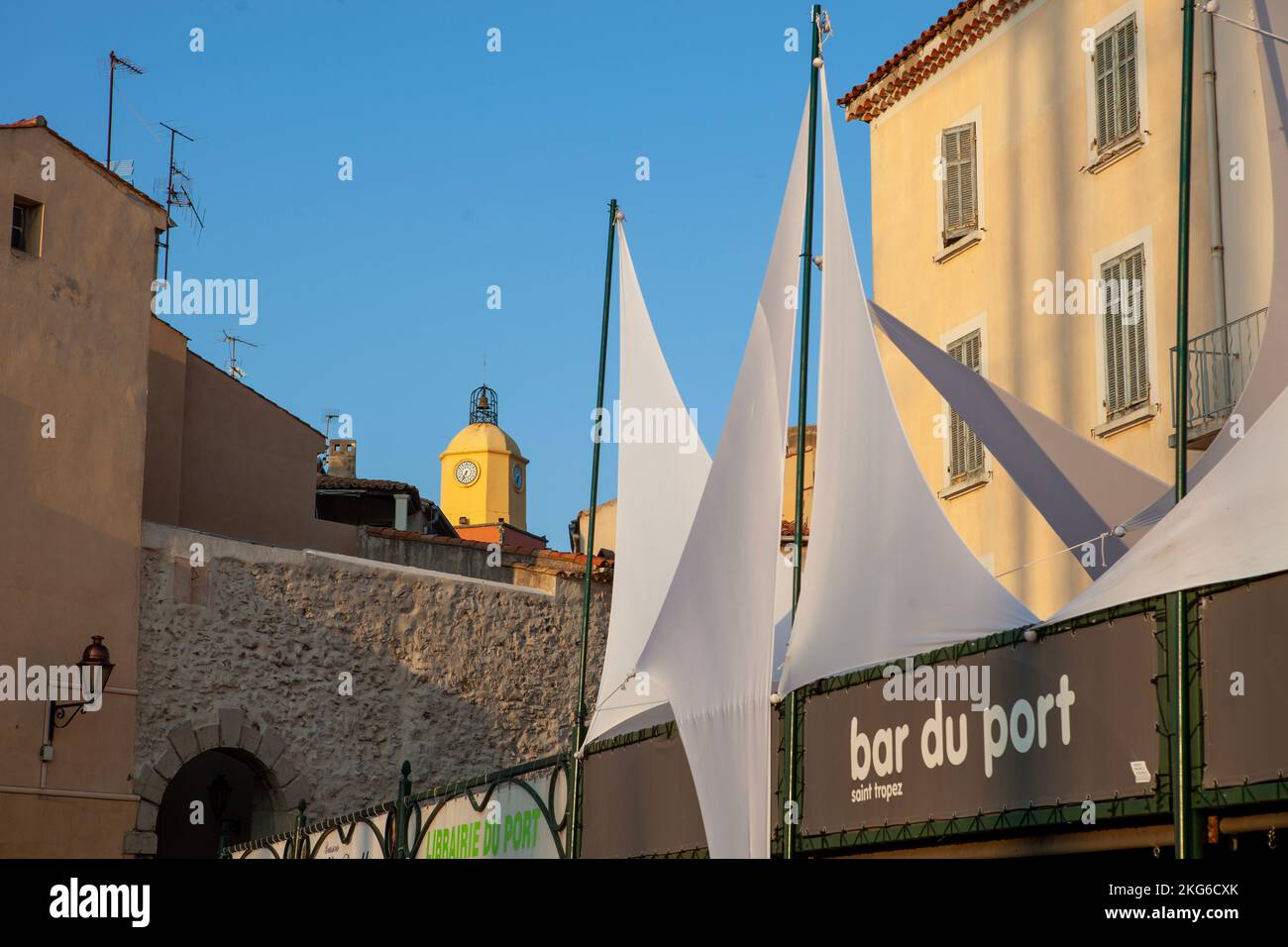 Saint-Tropez church bell tower ans small white sails Stock Photo - Alamy