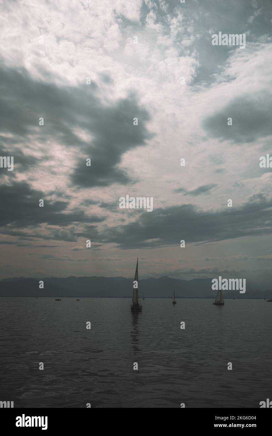 An aerial view of boats floating in sea during sunset Stock Photo - Alamy