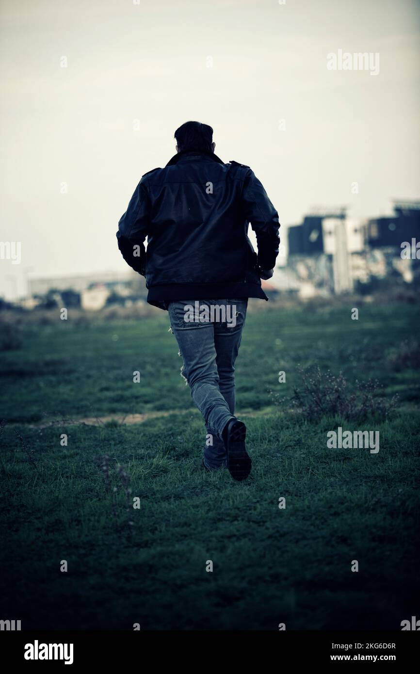 Middle man running behind hi-res stock photography and images - Alamy