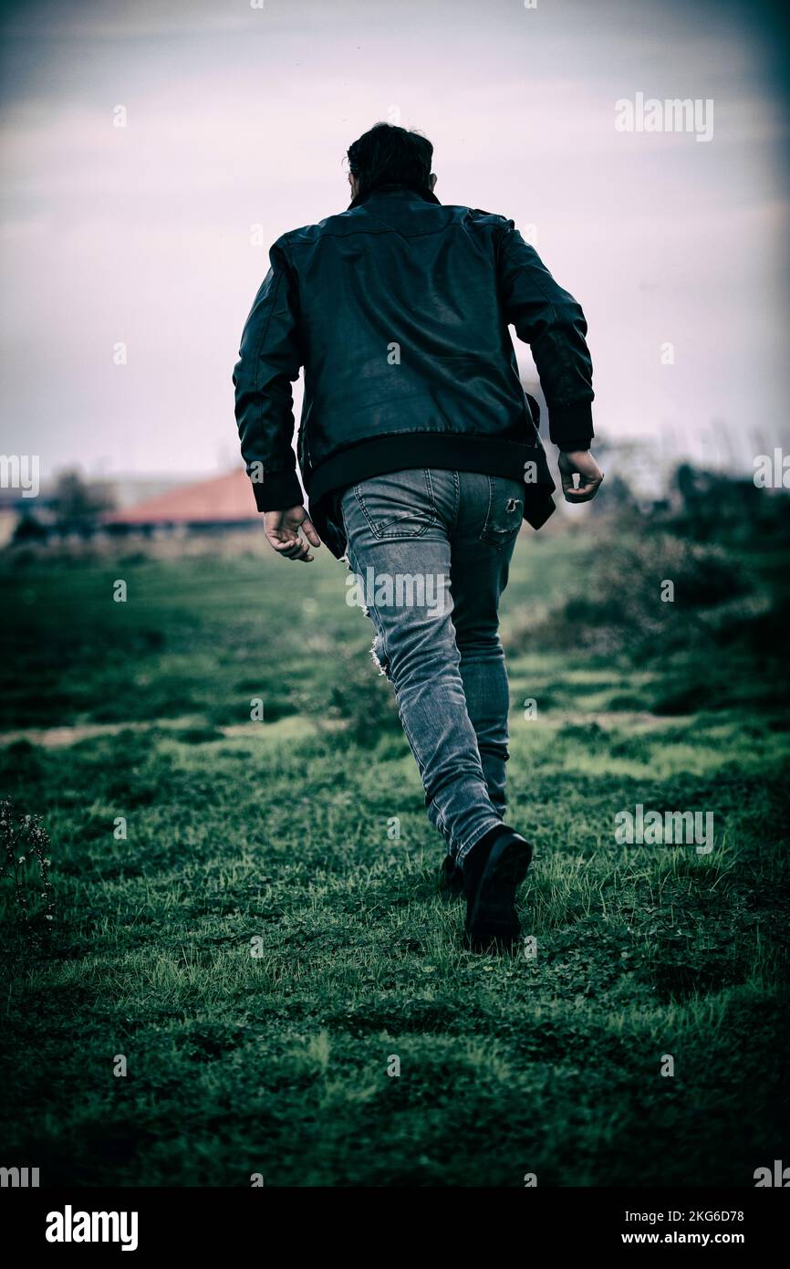 Middle man running behind hi-res stock photography and images - Alamy