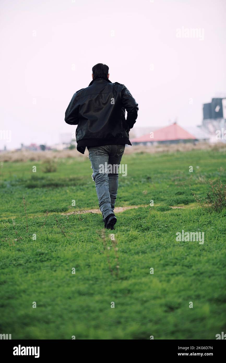 Man running away danger hi-res stock photography and images - Alamy