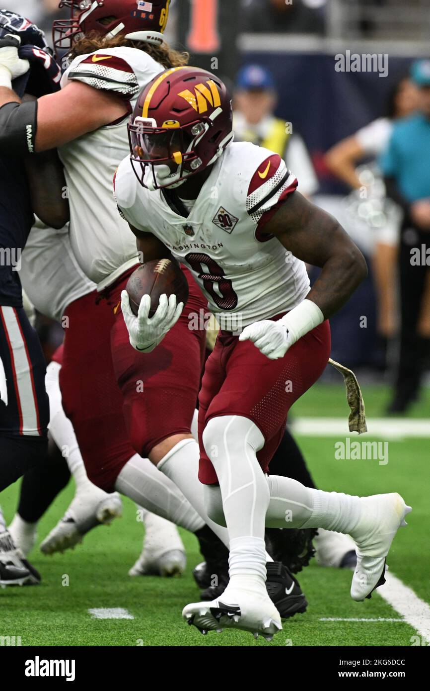 Washington Commanders running back Brian Robinson Jr. (8) runs the ball ...