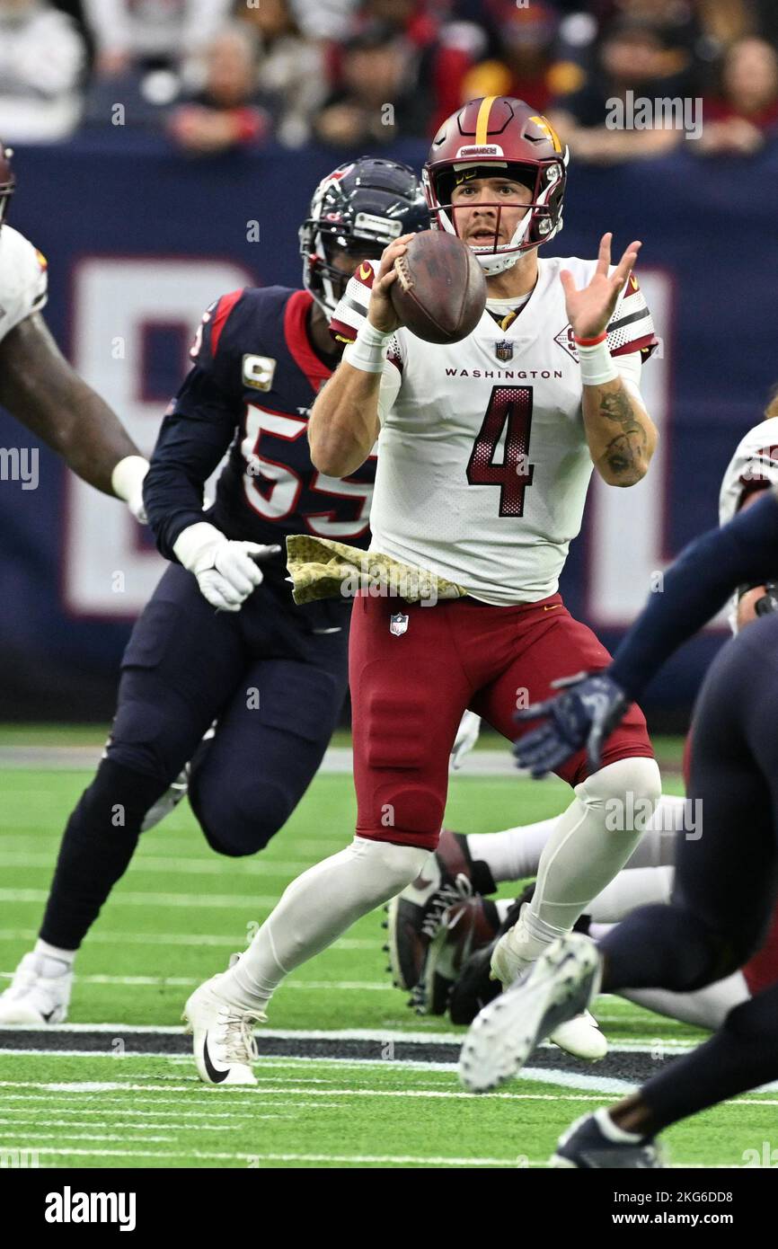 Washington Commanders quarterback Taylor Heinicke (4) scrambles with ...