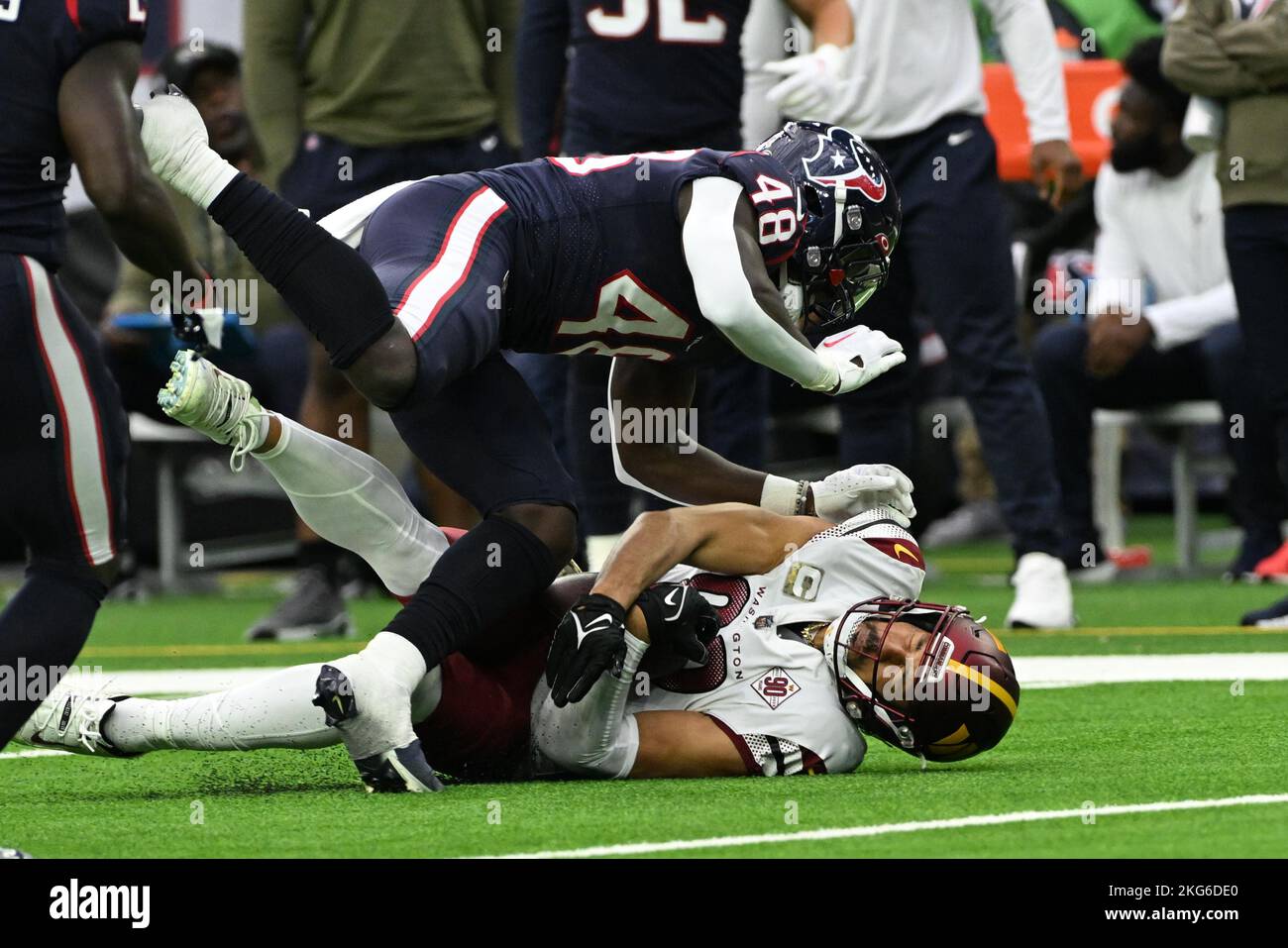 Houston Texans linebacker Christian Harris (48) takes down Washington ...