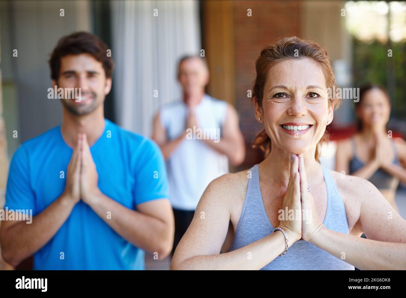 Ready for our yoga class. Portrait of a yoga class in progress Stock ...