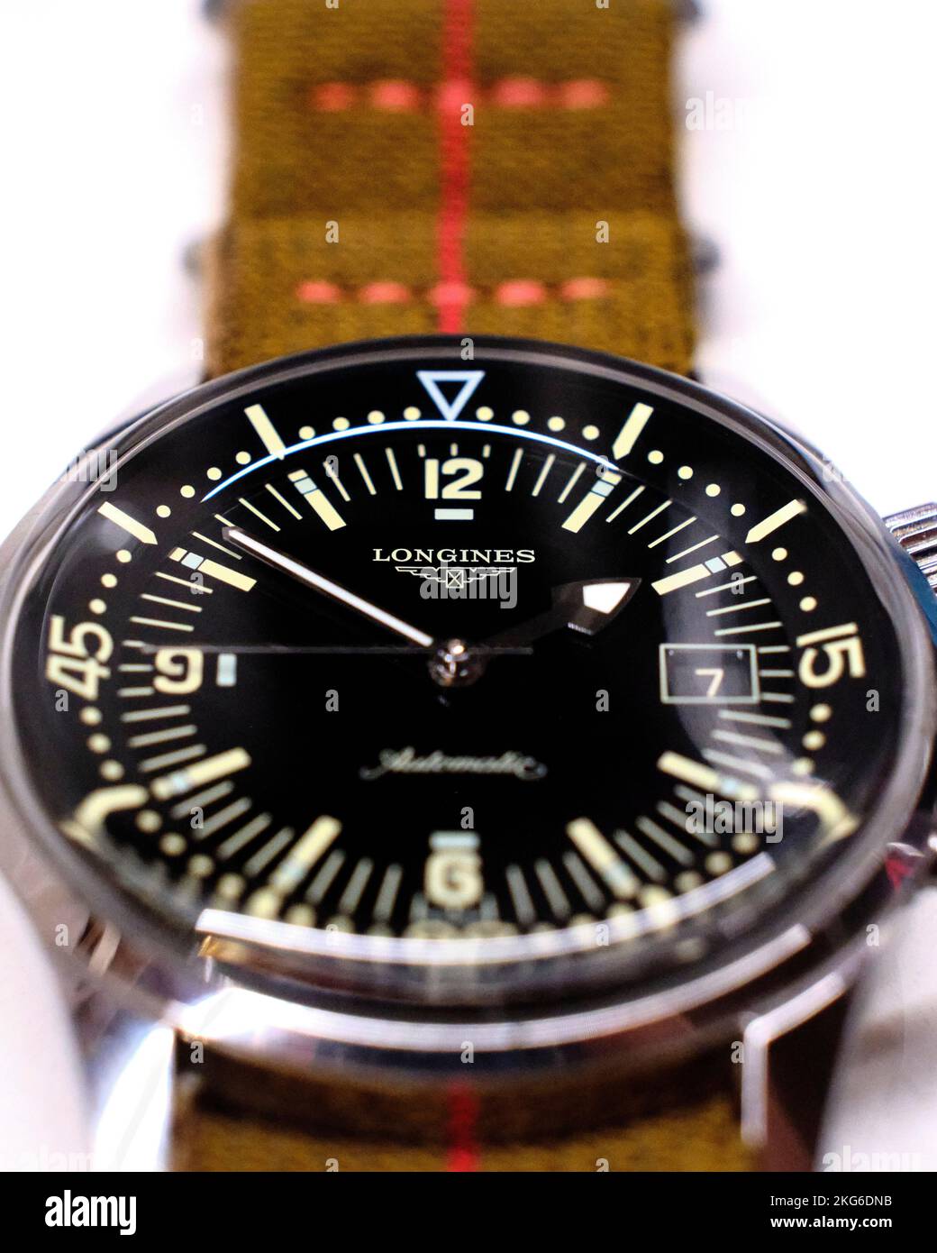 A vertical close-up of Longines Legend Diver watch with a cloth strap o ...