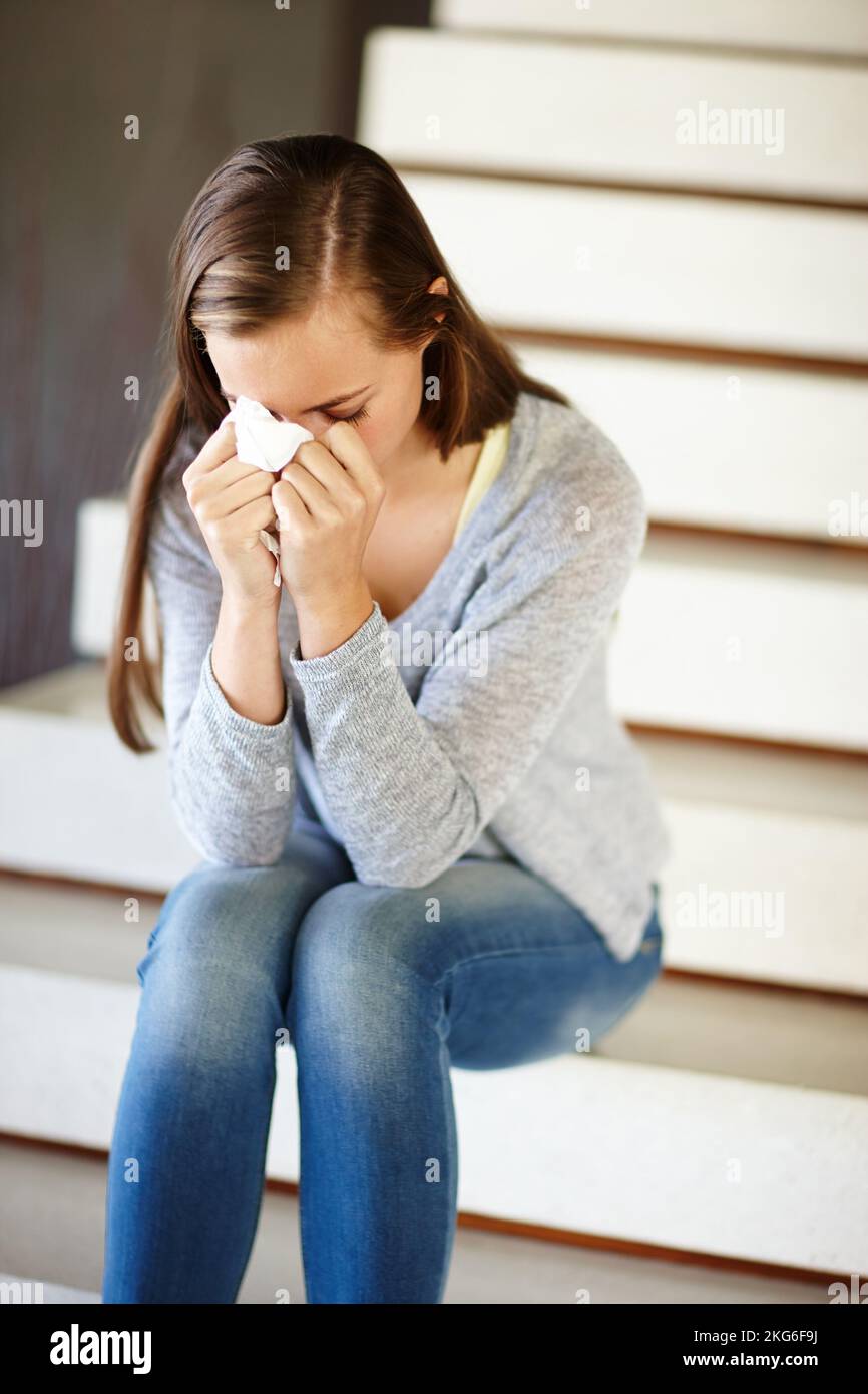 When you feel like hope is lost. an unhappy young woman crying on a ...