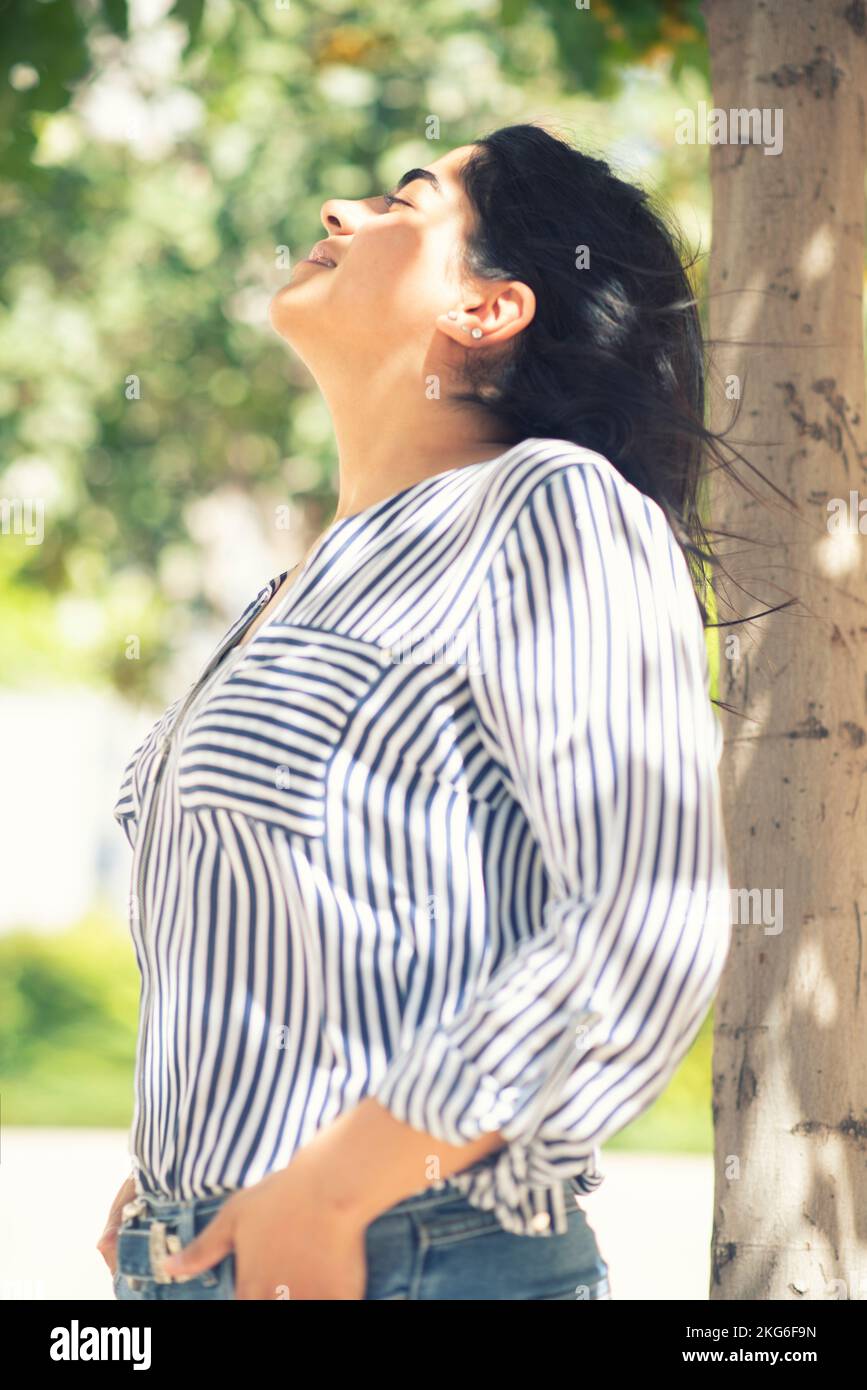 Beautiful young woman outdoors Stock Photo - Alamy